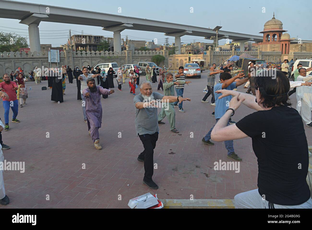 Pakistani people performing yoga session at the historical Shalimar ...