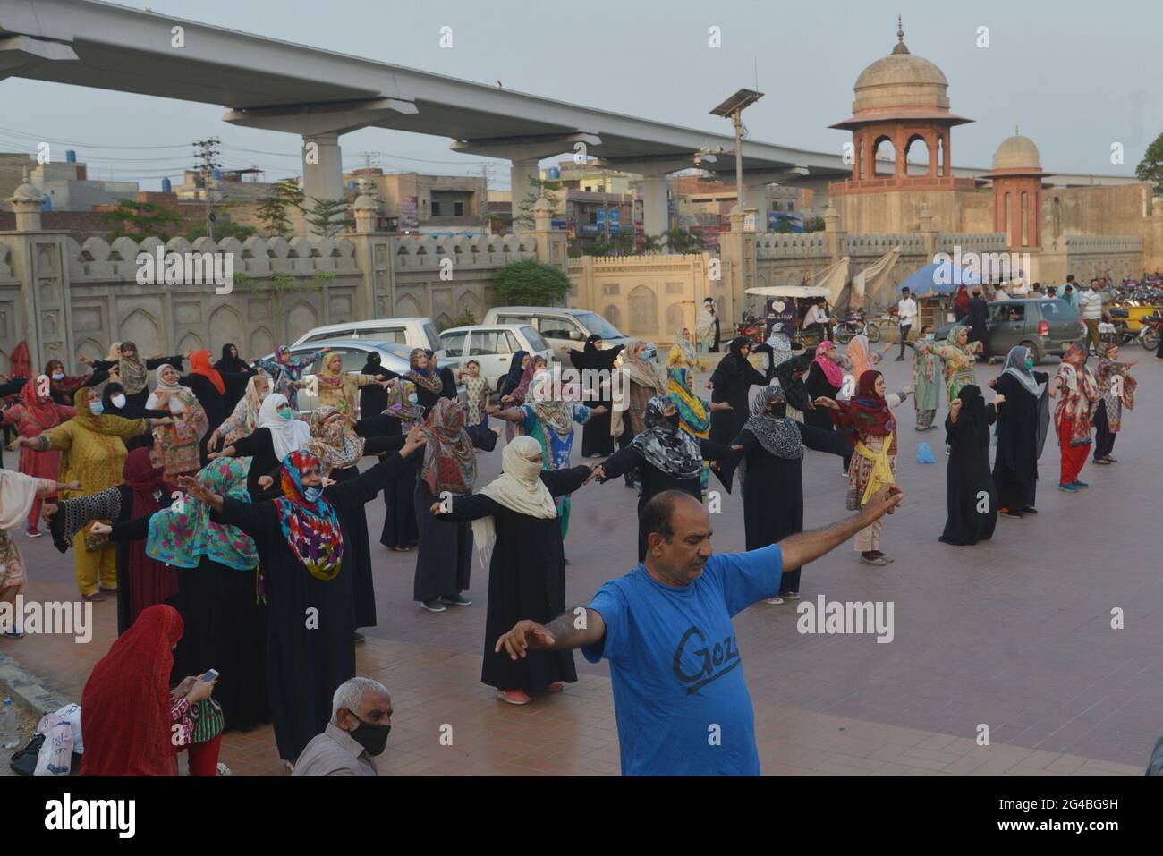 Pakistani people performing yoga session at the historical Shalimar ...