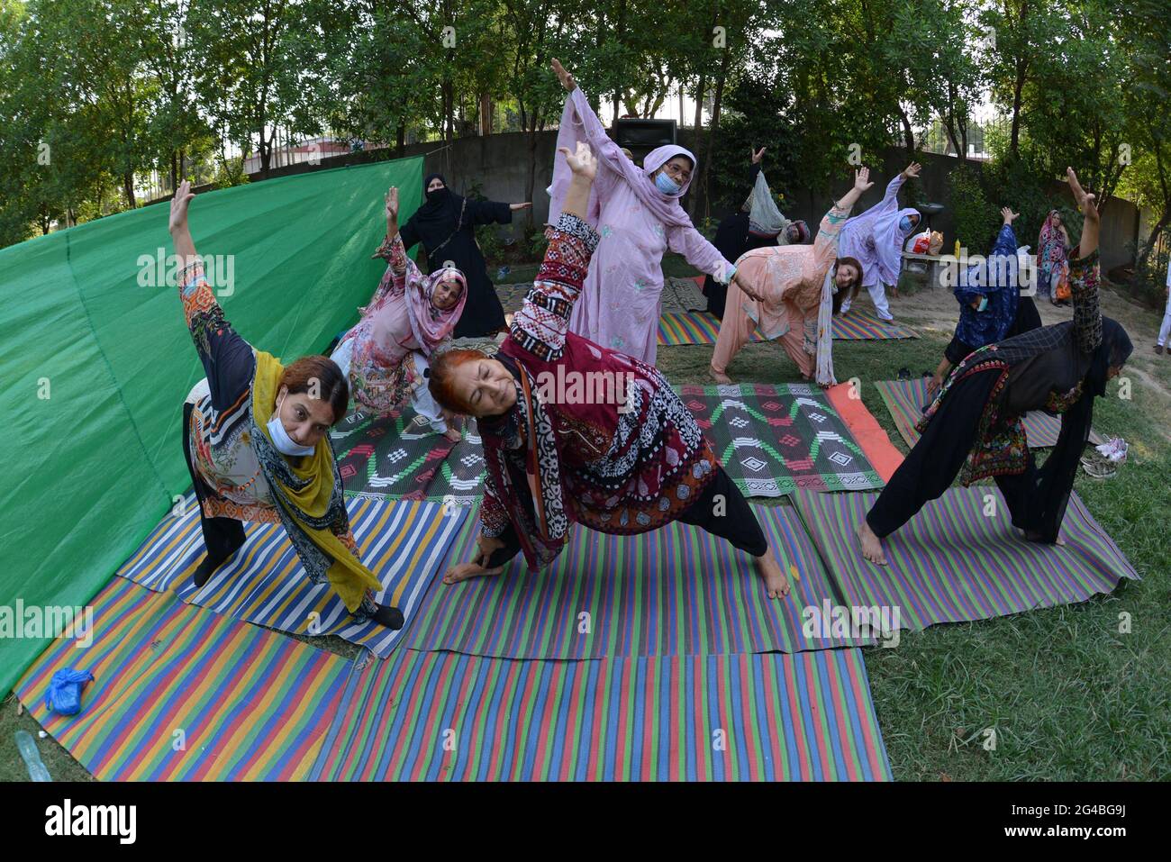 Pakistani people performing yoga session at the historical Shalimar ...