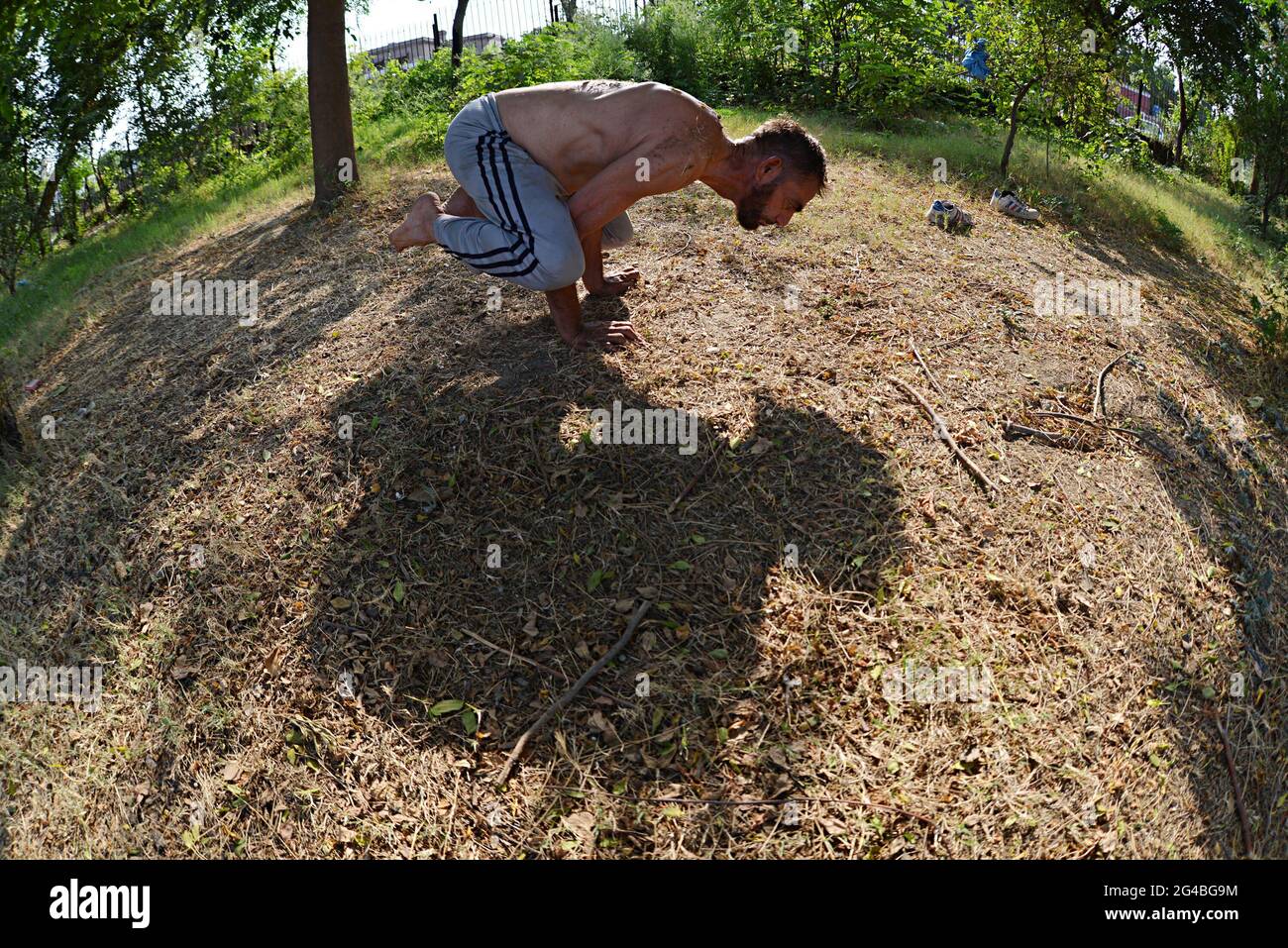 Pakistani people performing yoga session at the historical Shalimar ...