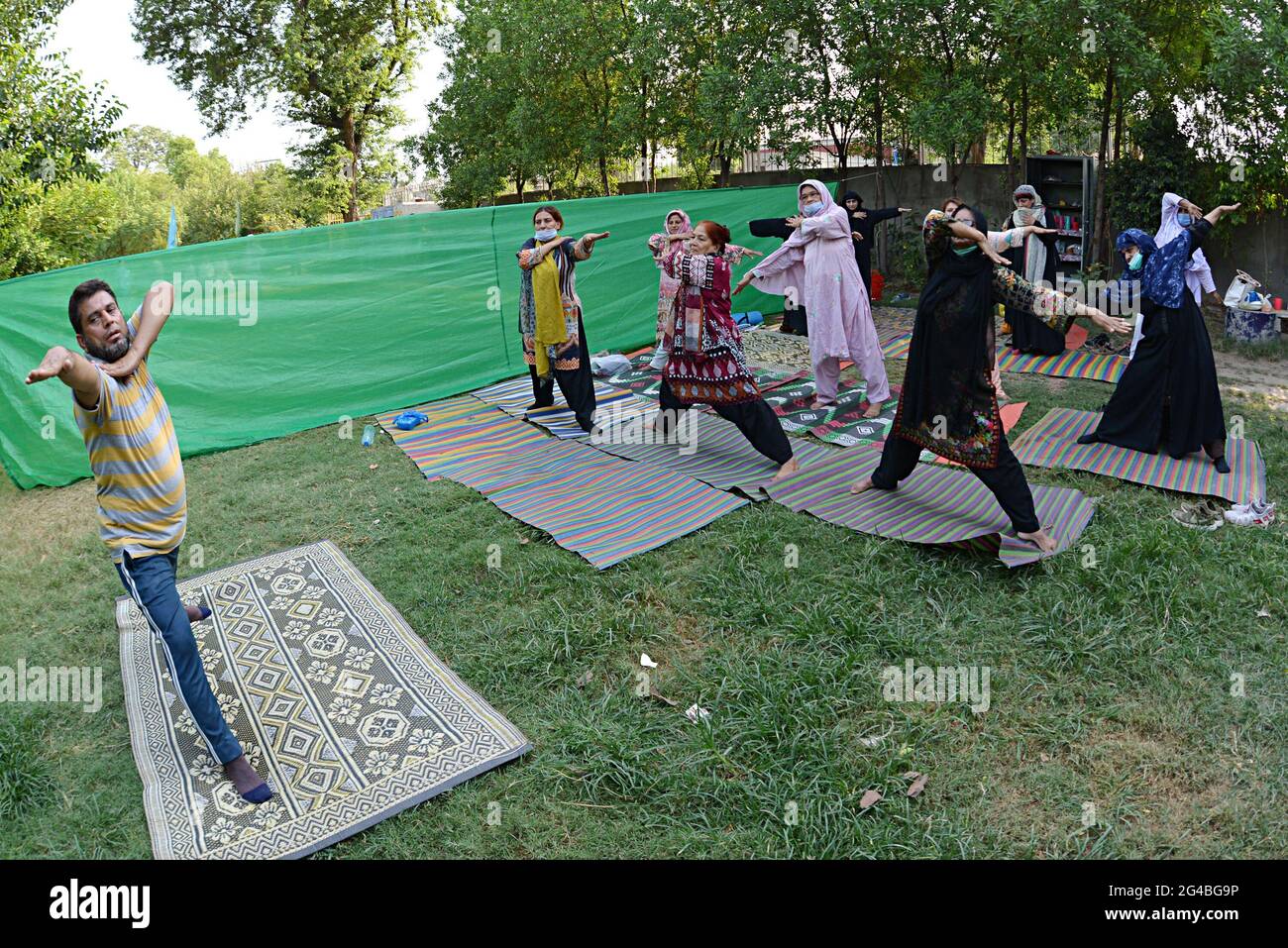Pakistani people performing yoga session at the historical Shalimar ...