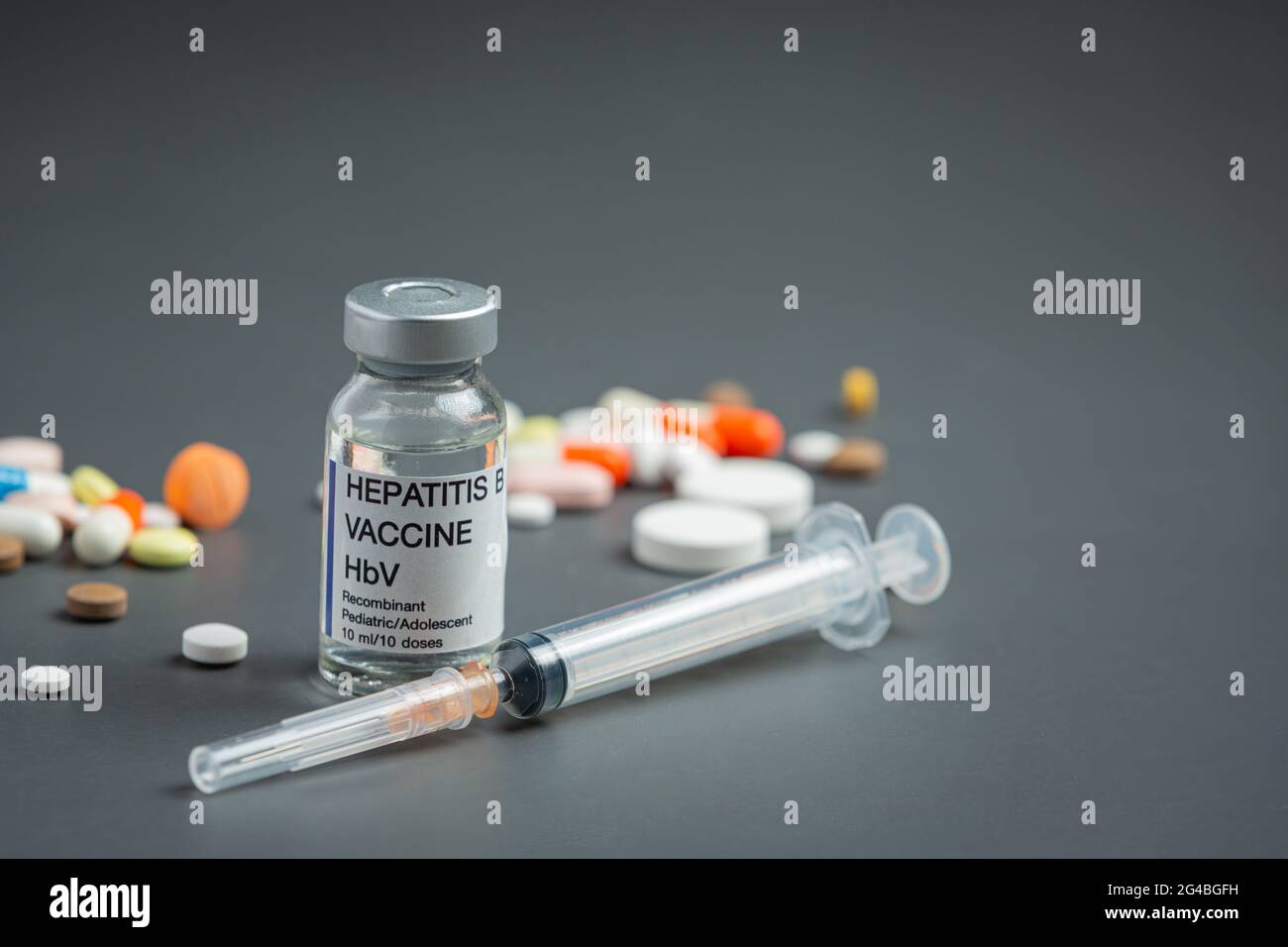 world hepatitis day concept with medical tools and pills placed on gray ...