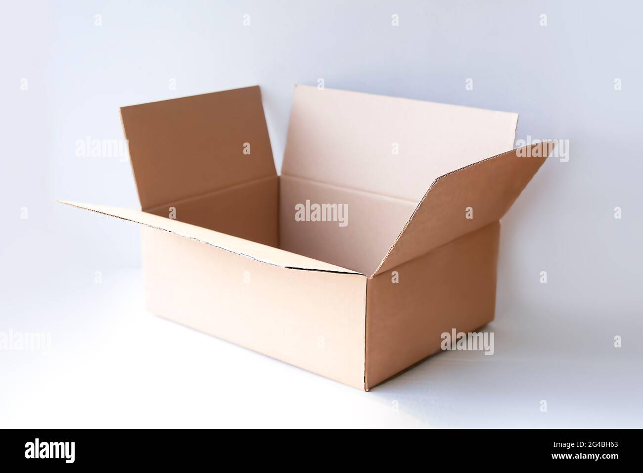 Empty cardboard box on the white background Stock Photo - Alamy