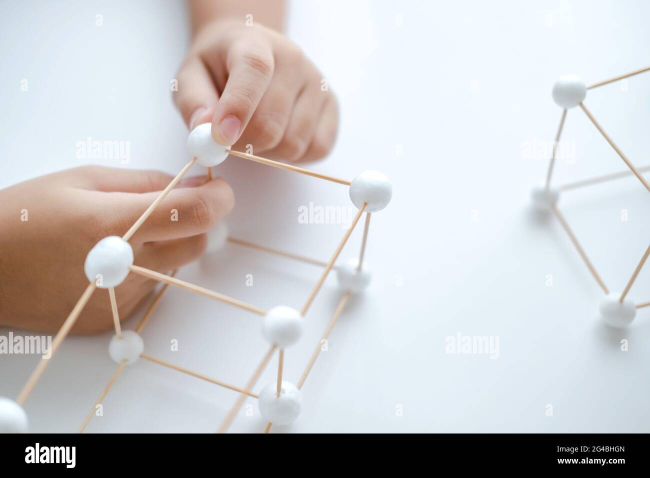 STEM education, Child learning making 3D geometric shapes, Building ...