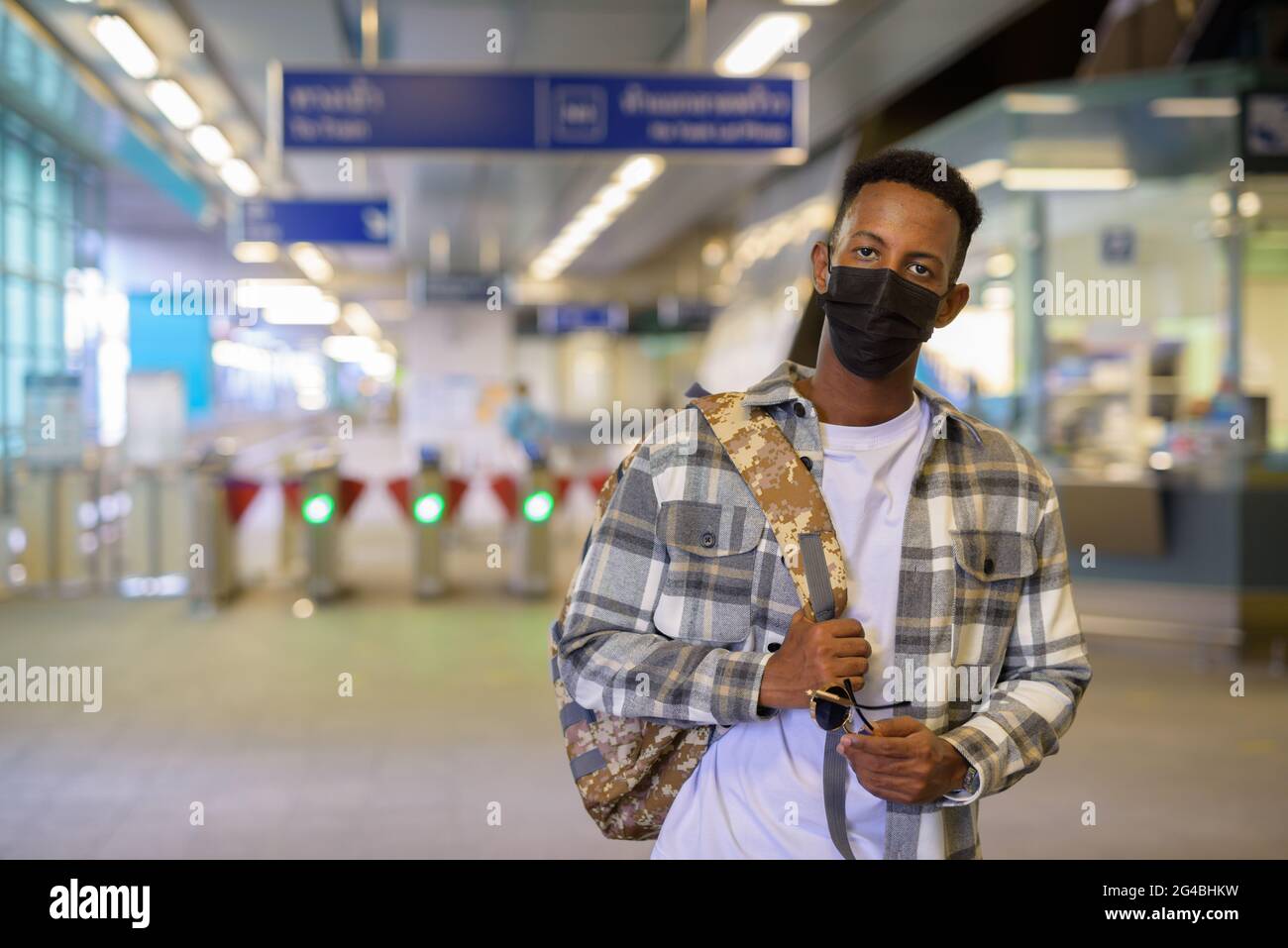 Portrait of African black man outdoors in city during summer horizontal ...
