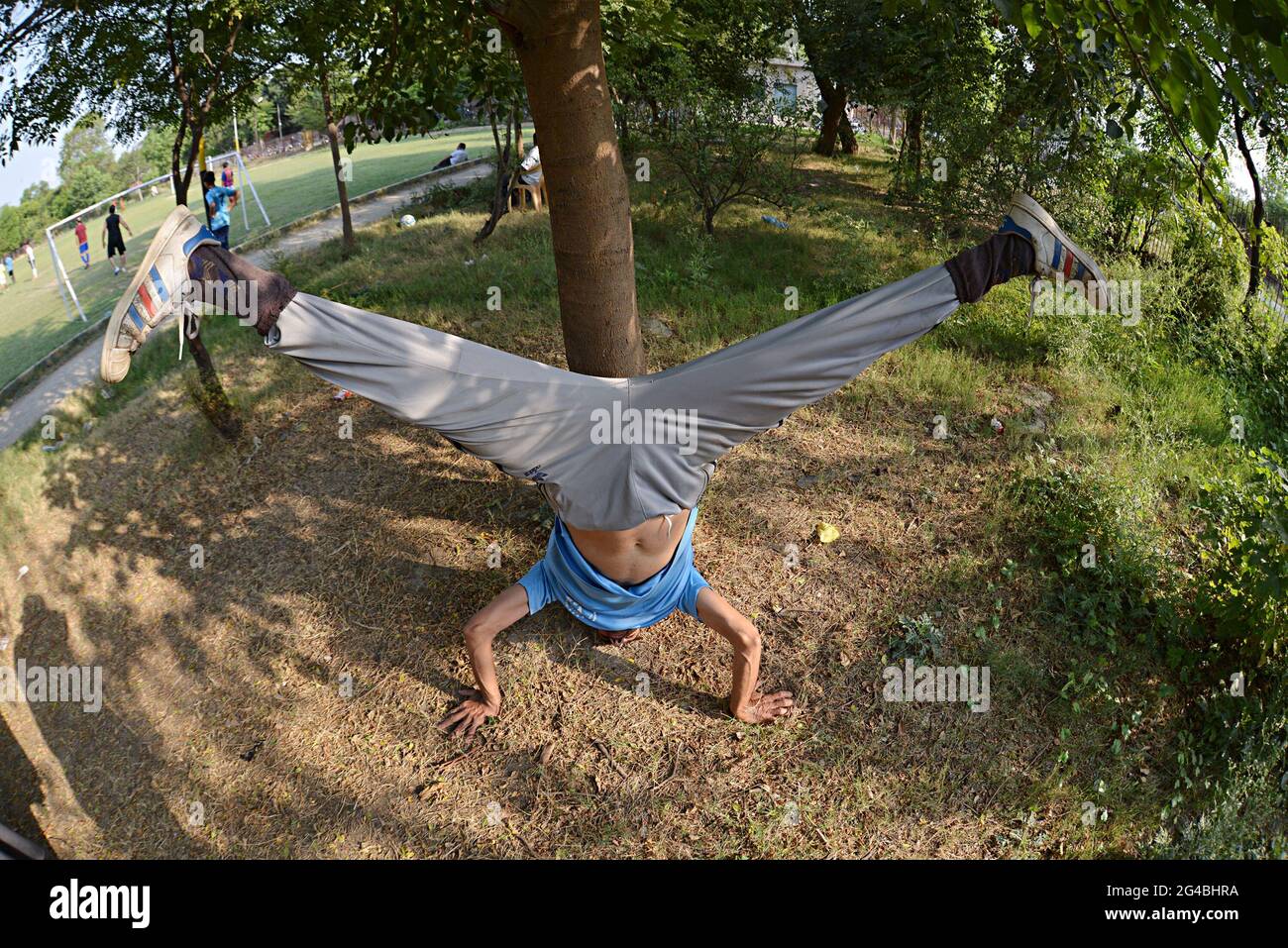 Lahore, Pakistan. 20th June, 2021. Pakistani people performing yoga ...