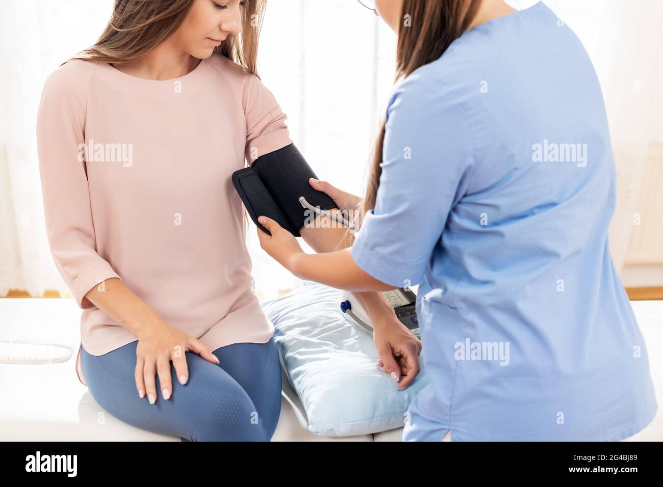 Nurse taking the pulse hi-res stock photography and images - Alamy