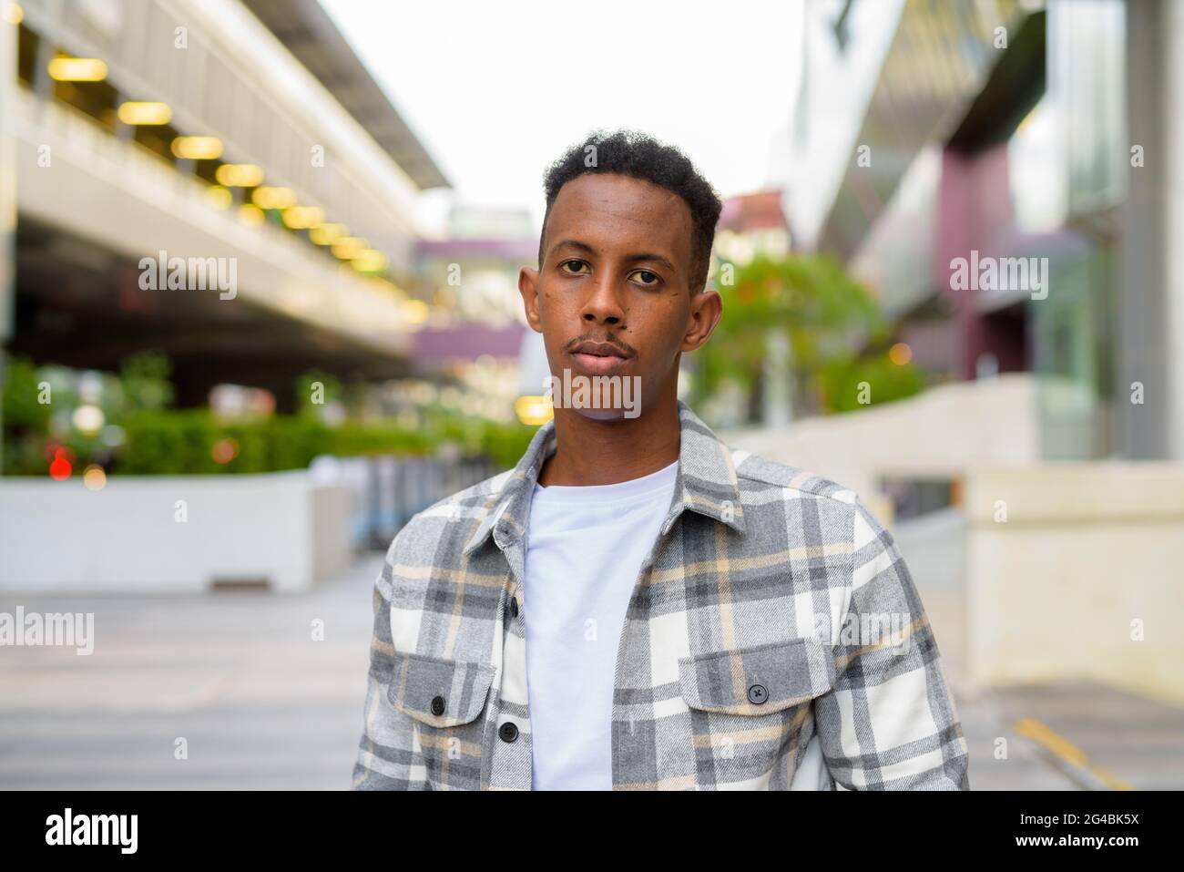 Portrait of African black man outdoors in city during summer Stock ...