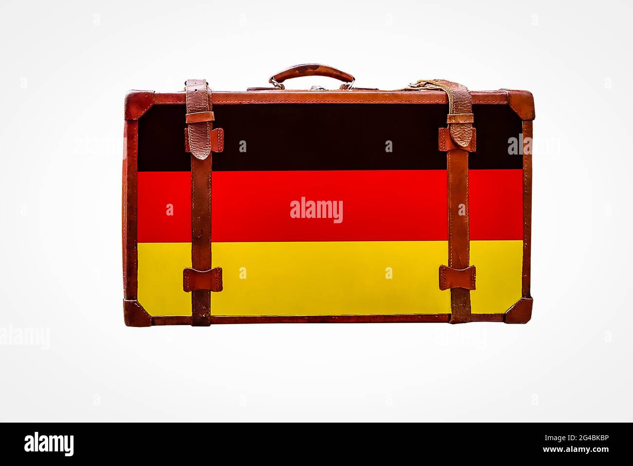 A closeup shot of old luggage with the German flag on the center isolated on a white background ...