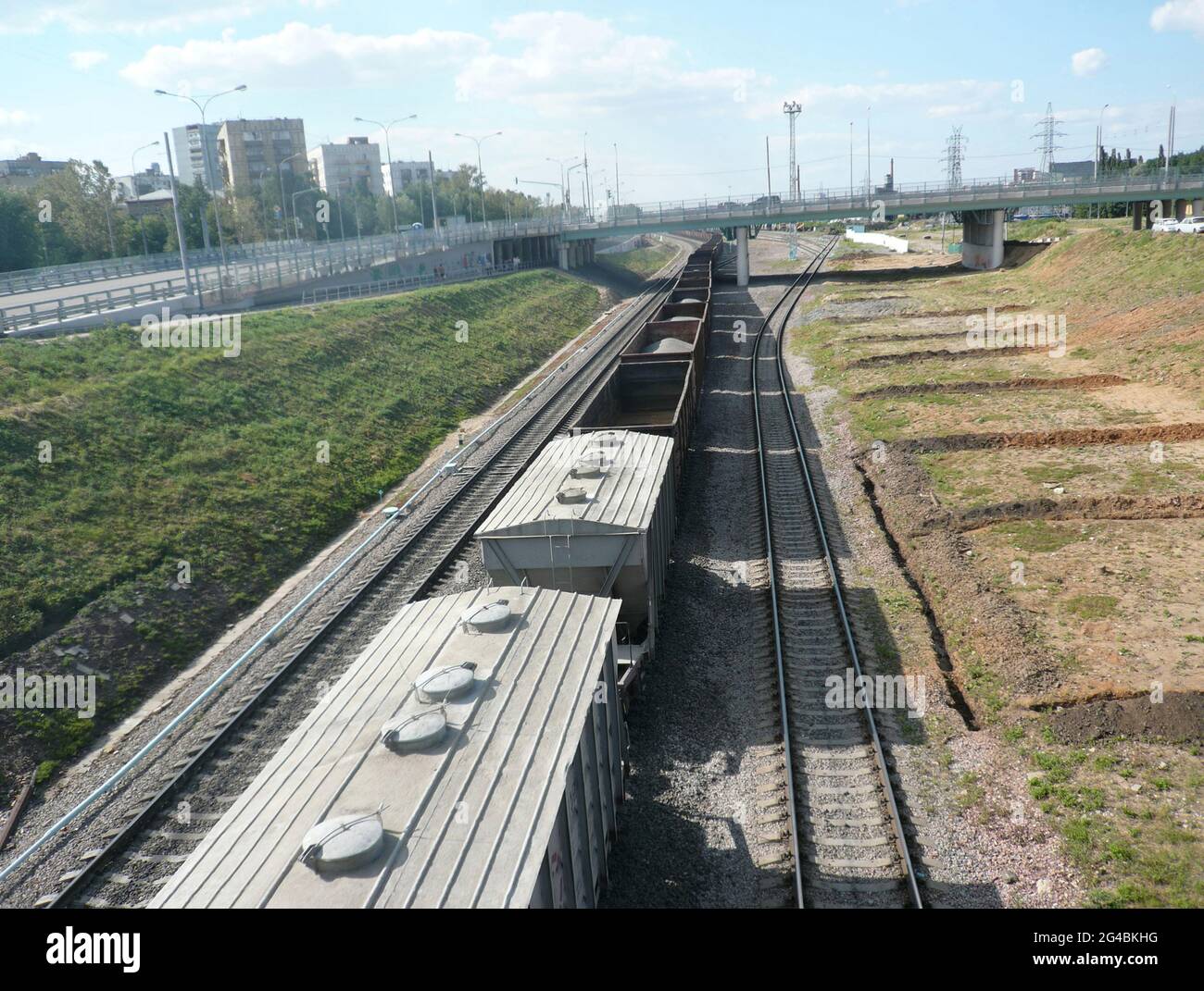 goods train with bulk cargo at sunny day Stock Photo - Alamy