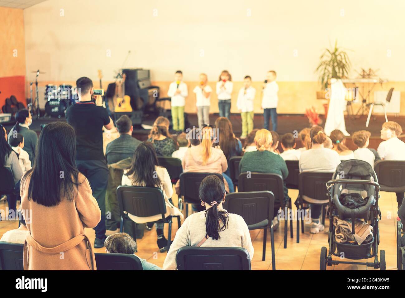 Children on the stage. Children on stage perform in front of parents ...