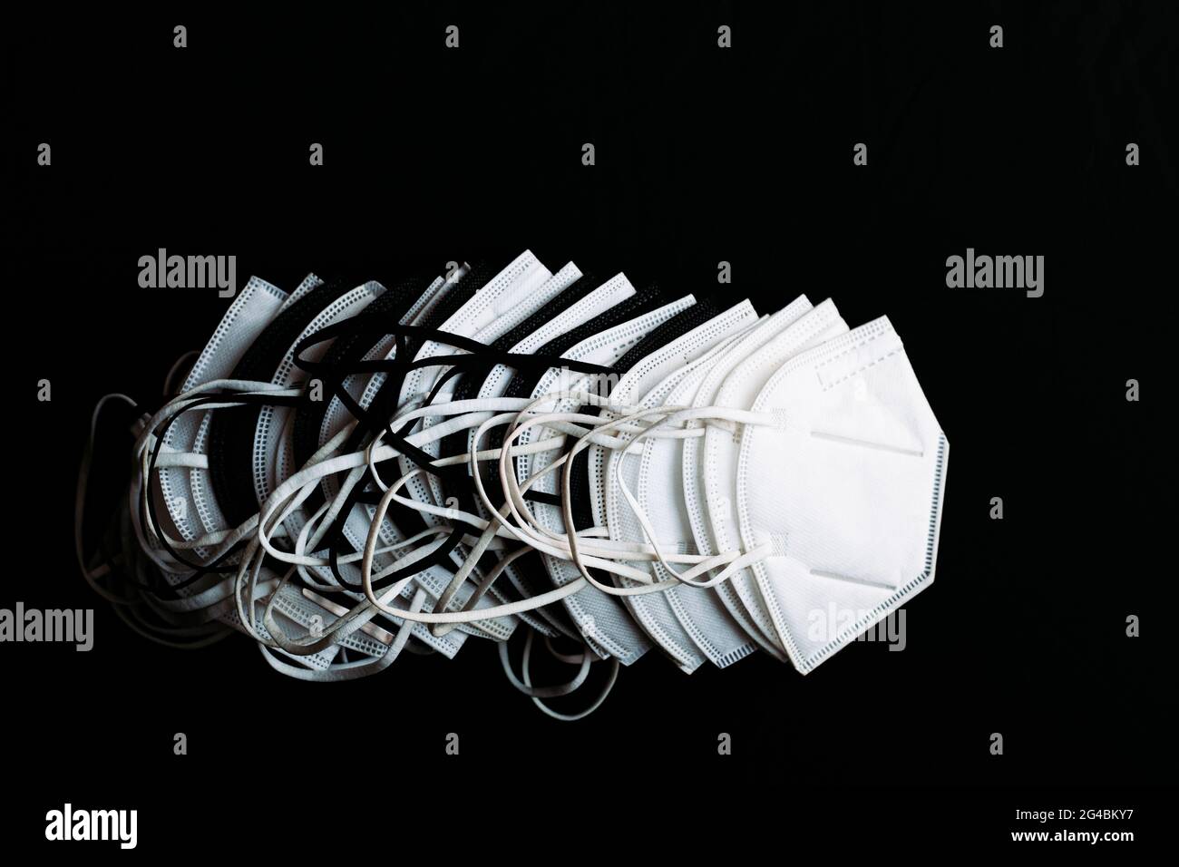 Photo of a group of KN95 masks isolated on black Stock Photo - Alamy