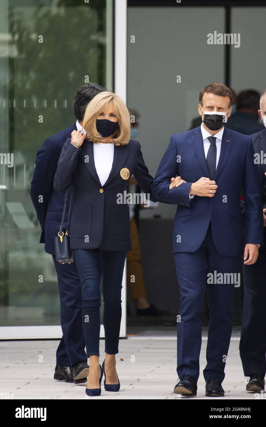 French President Emmanuel Macron and his wife Brigitte Macron a polling ...