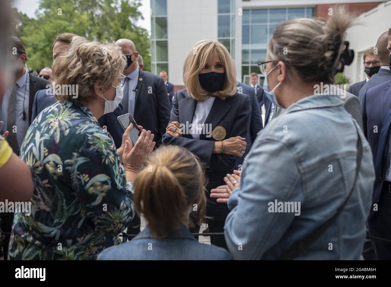 French President Emmanuel Macron and his wife Brigitte Macron a polling ...