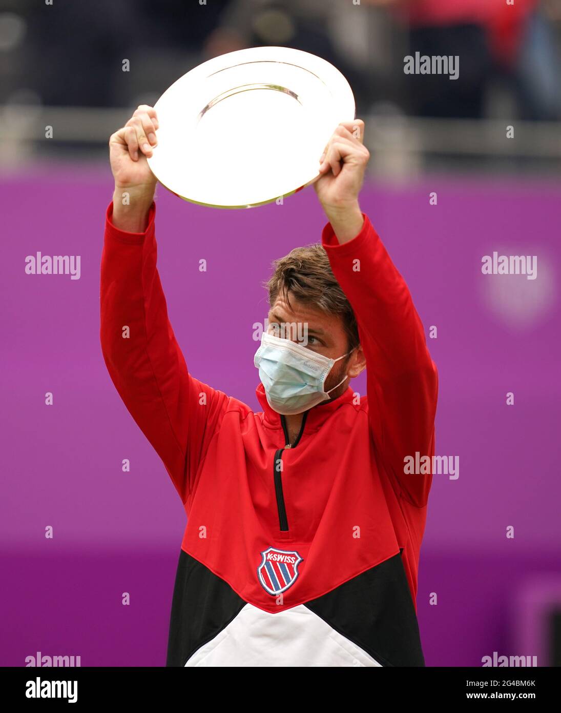 Great Britain's Cameron Norrie lifts the runners up trophy on day seven ...