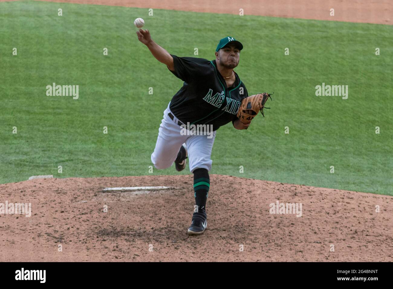 MEXICO CITY, MEXICO - JUNE 19: Isaac Jimenez # 3 of Mexico team pitches ...