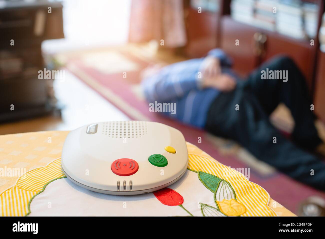 Device delivering emergency single button call for senior man Stock ...