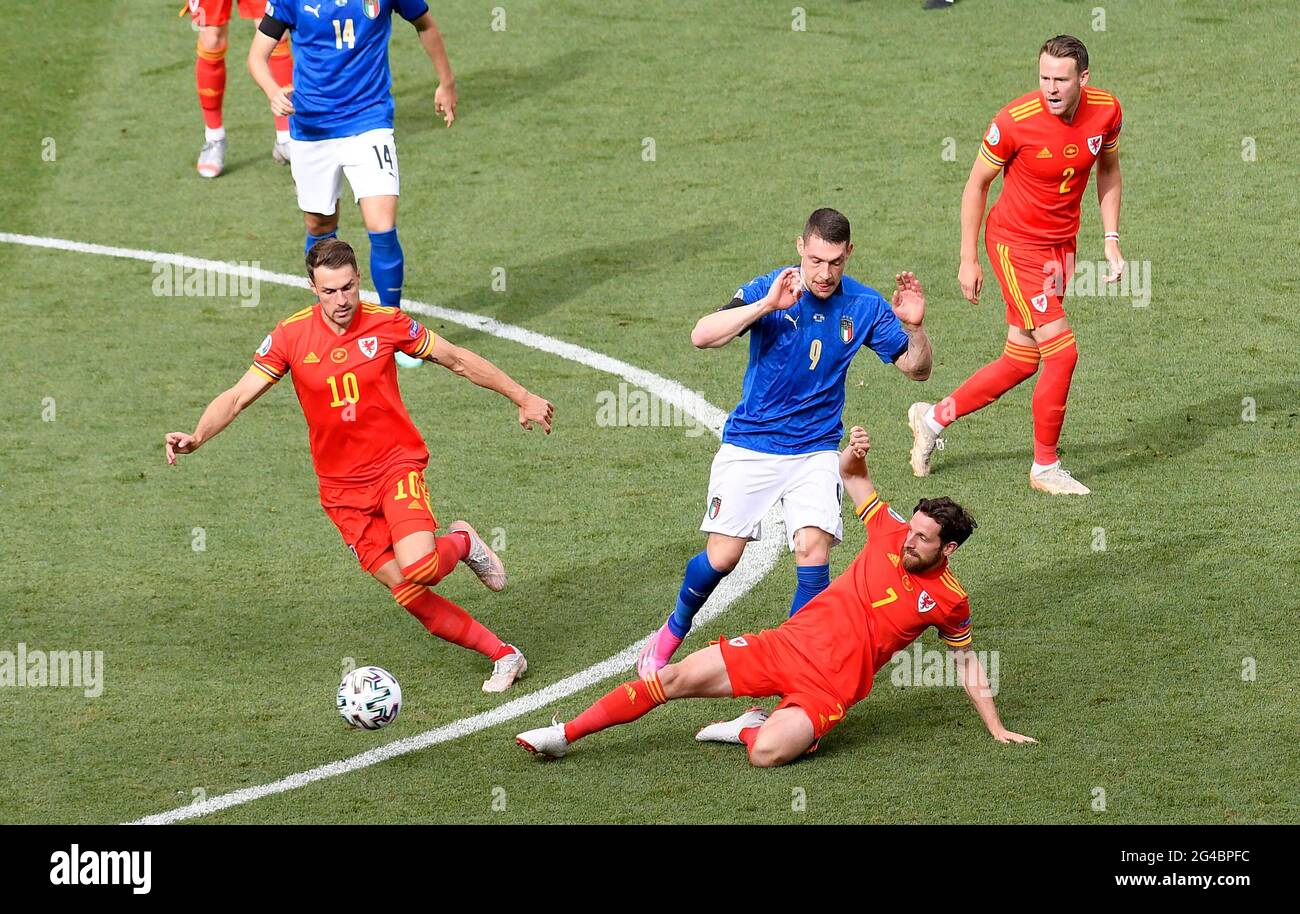 Italy's Andrea Belotti and Wales' Joe Allen battle for the ball during ...
