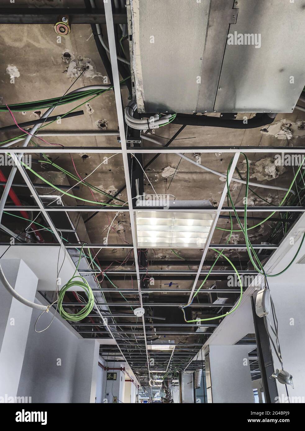 A low-angle shot of the ventilation systems on the roof of a corridor ...
