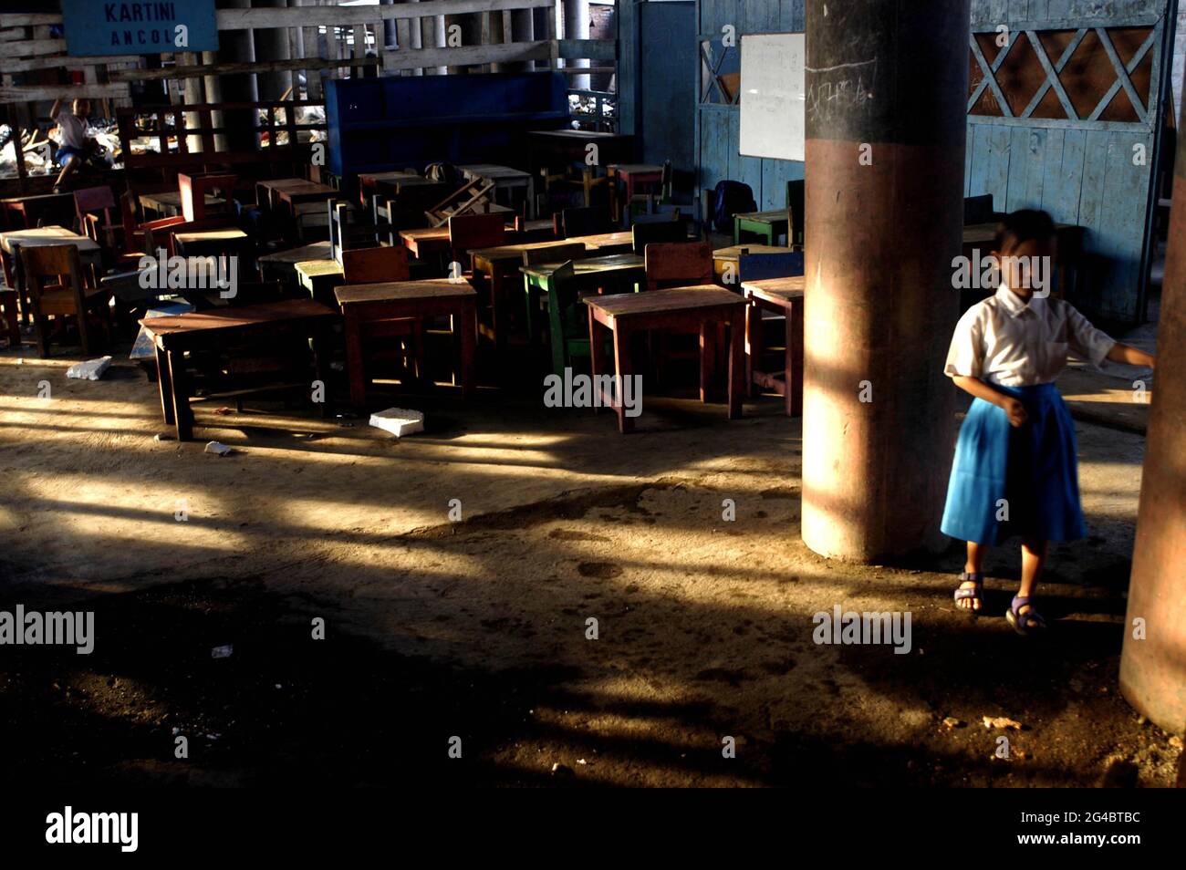 A student stands in front of the class shortly before classes start at ...