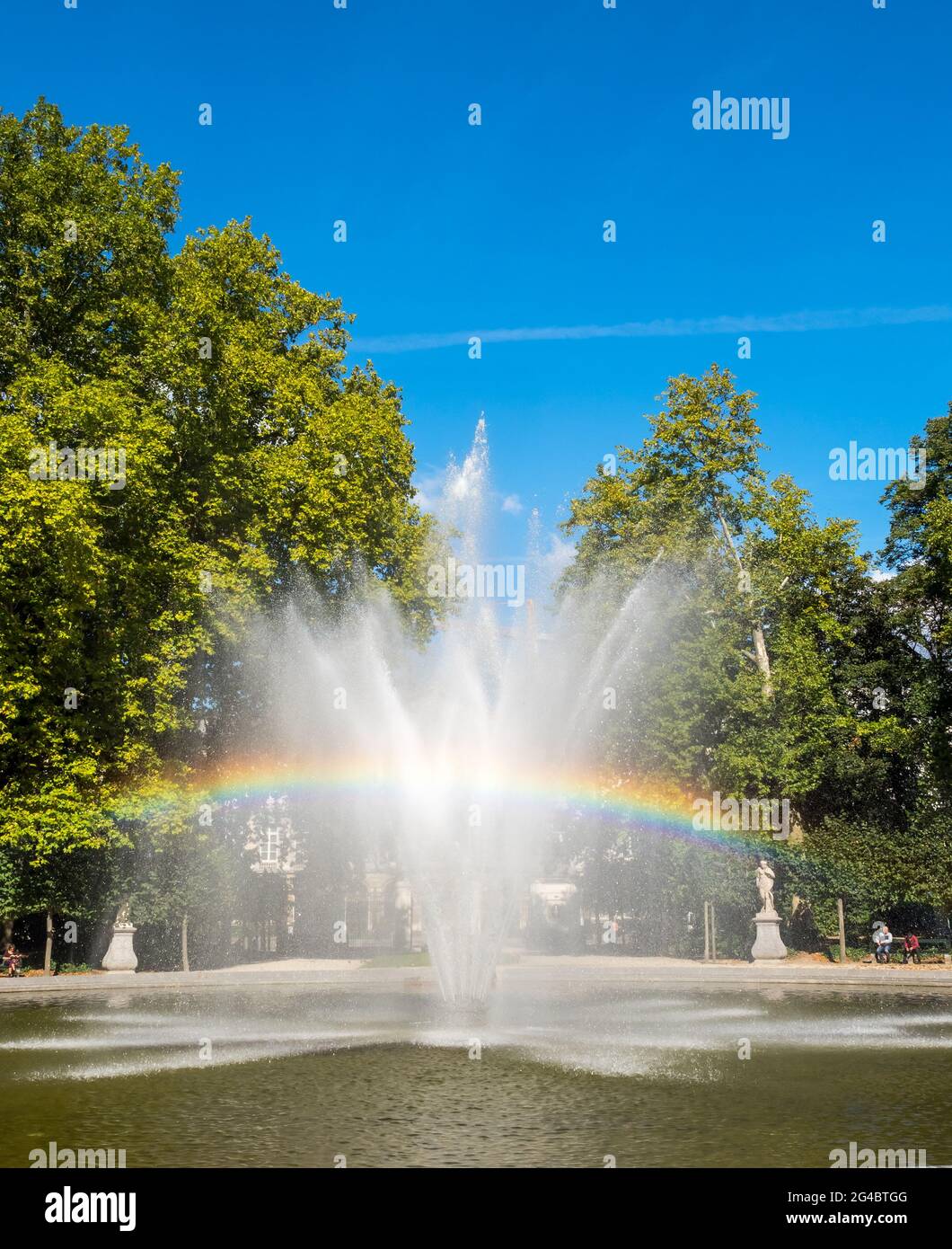 Artificial fountain with reflected bubble water rainbow in natural park ...