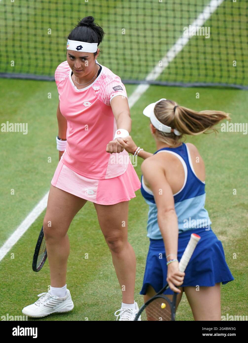 Australia's Ellen Perez (right) and Tunisia's Ons Jabeur in action ...