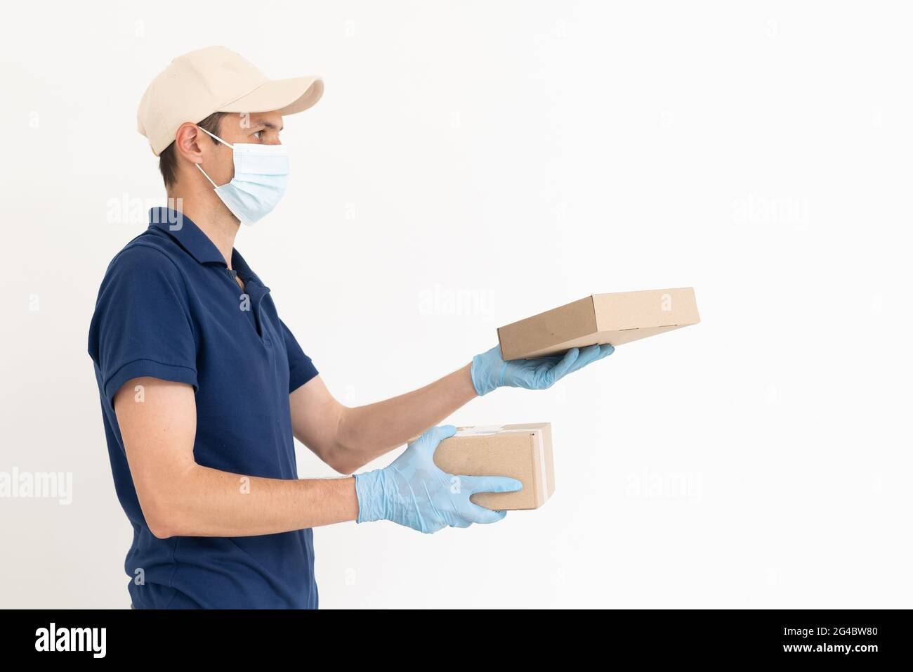 handsome young delivery man portrait on white Stock Photo - Alamy