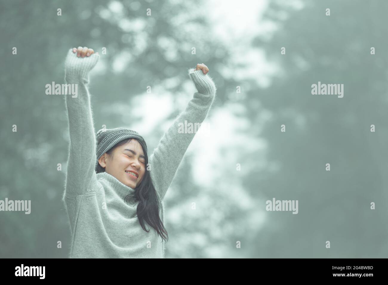 girl standing in the cold wind on vacation Stock Photo - Alamy
