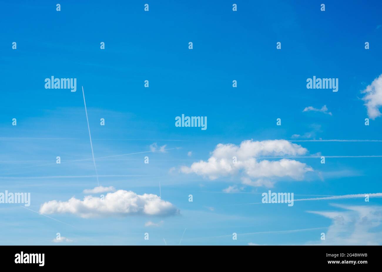 Cloud and jet contrail with blue sky background Stock Photo - Alamy