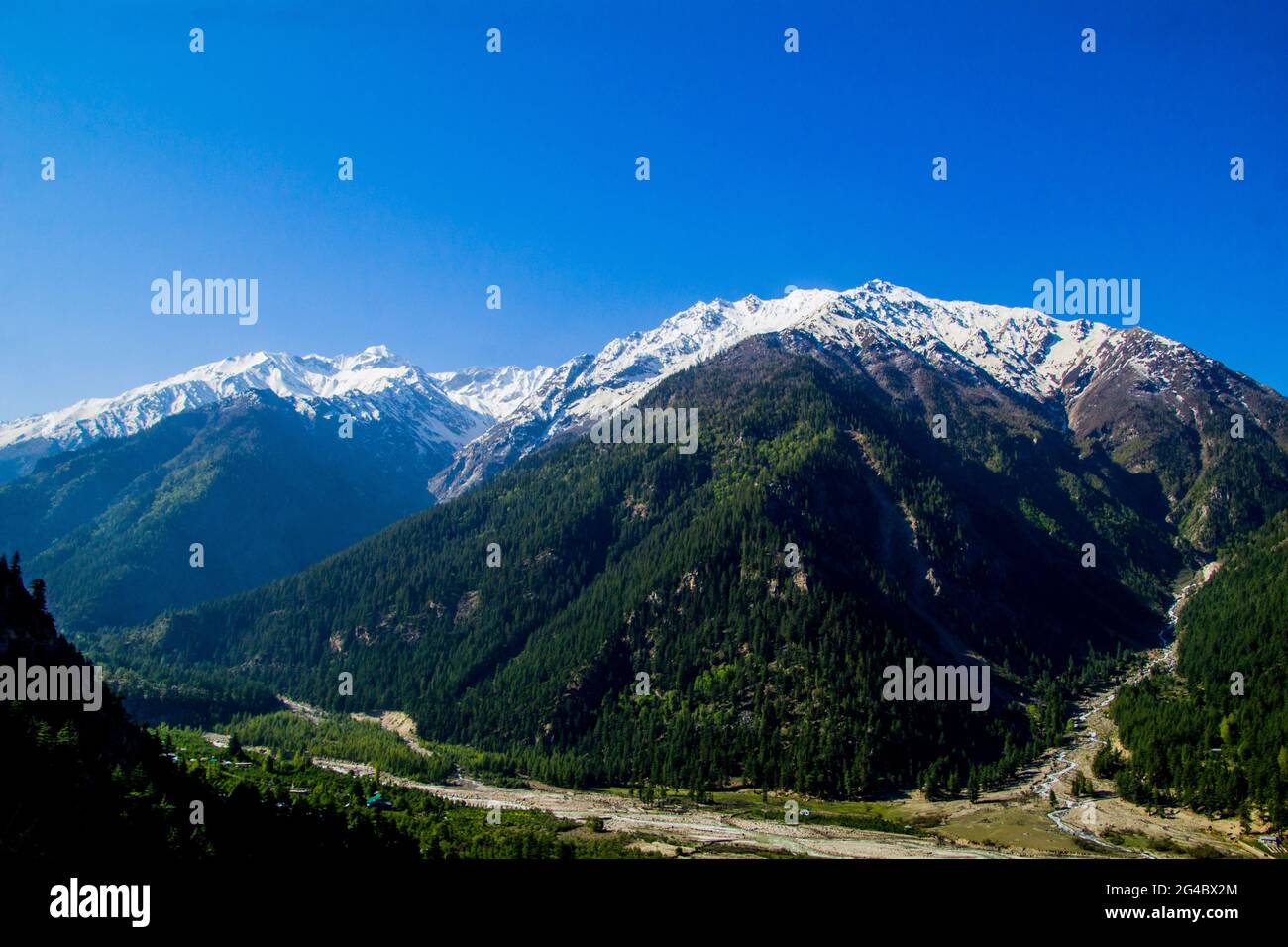 A hazy sunset in Sangla valley Stock Photo - Alamy