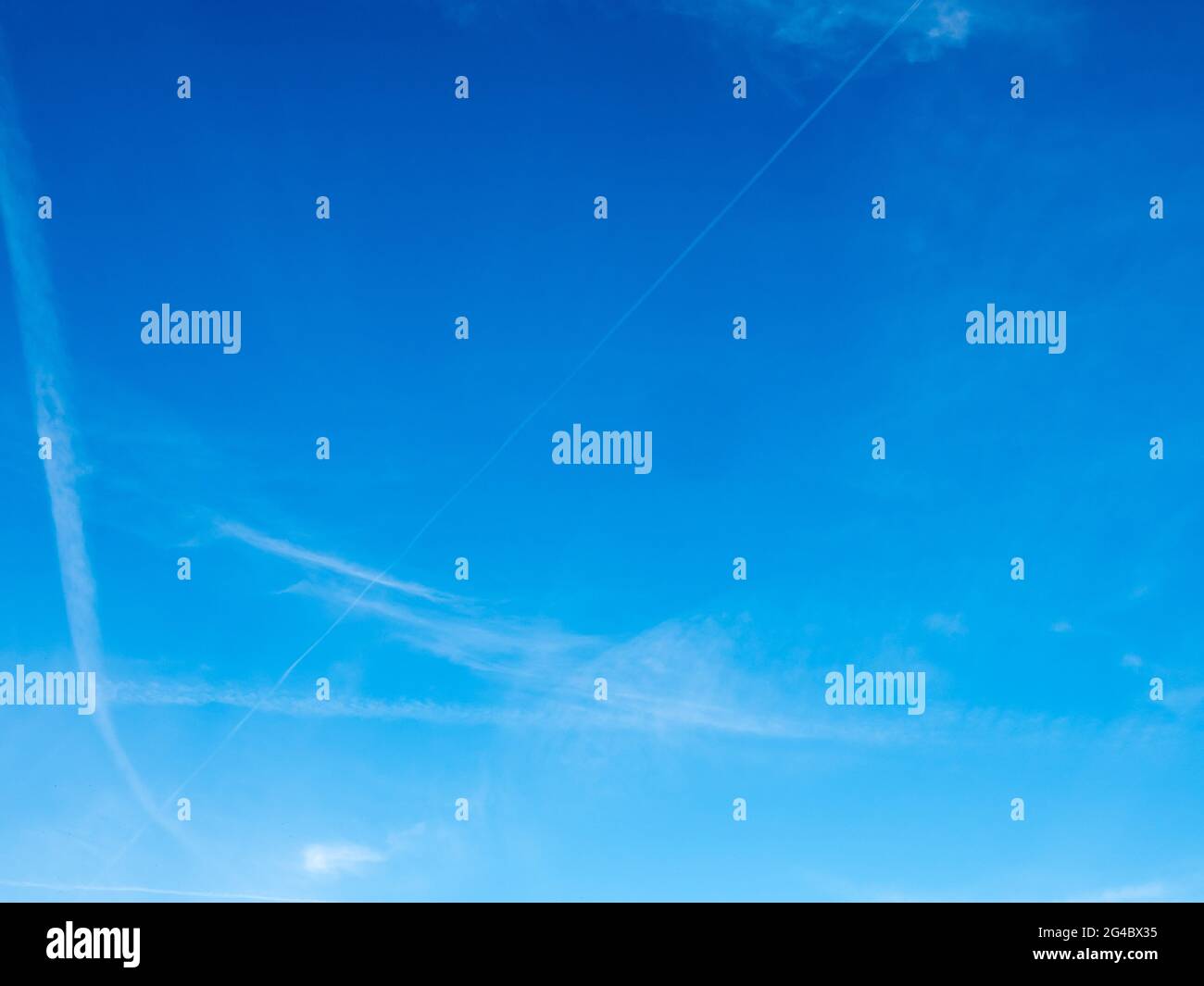 Cloud and jet contrail with blue sky background Stock Photo - Alamy