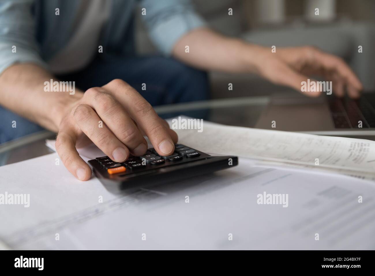 Close up young man managing household budget Stock Photo - Alamy