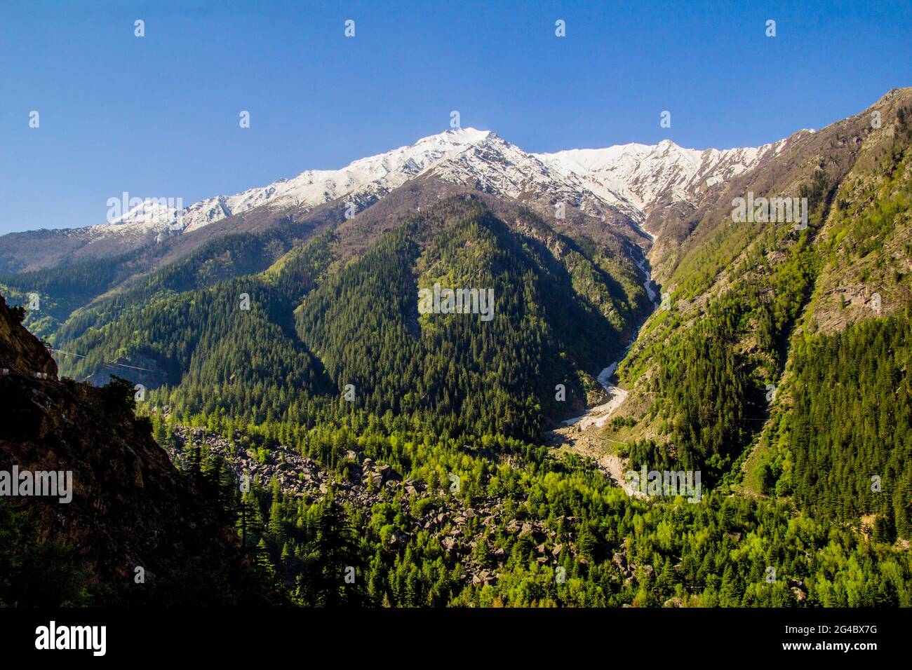 A hazy sunset in Sangla valley Stock Photo - Alamy