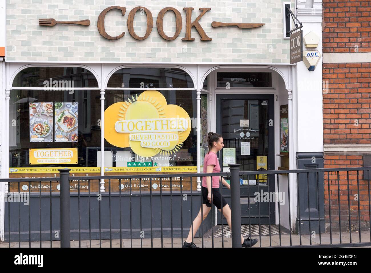 Woman walk past cook hi-res stock photography and images - Alamy