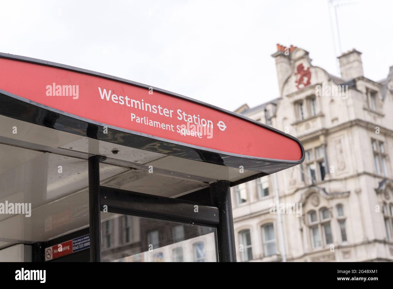 Westminster bu station sign written in white lettering on red back ...