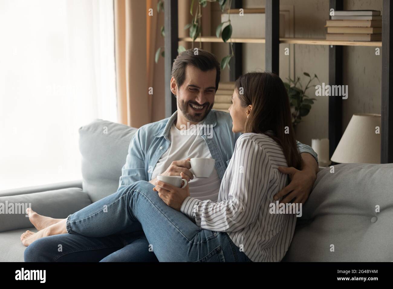 Relaxed happy family couple enjoying trusted conversation at home Stock ...