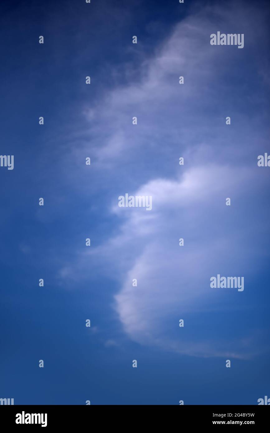 White clouds in blue sky. Vertical view Stock Photo - Alamy