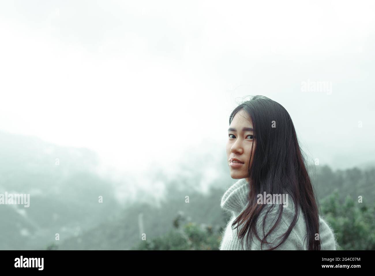 girl standing in the cold wind on vacation Stock Photo - Alamy