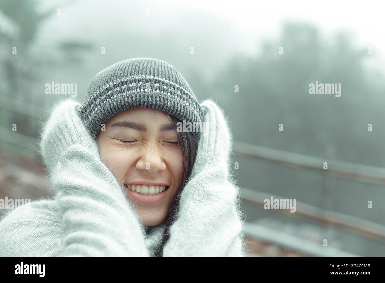 girl standing in the cold wind on vacation Stock Photo - Alamy