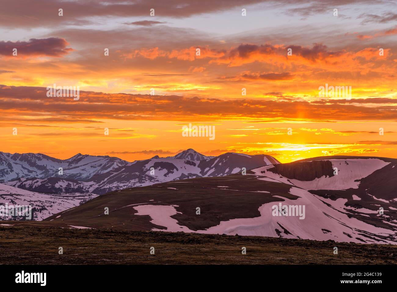 Sunset Mountain Road - Colorful Spring sunset clouds over Trail Ridge ...