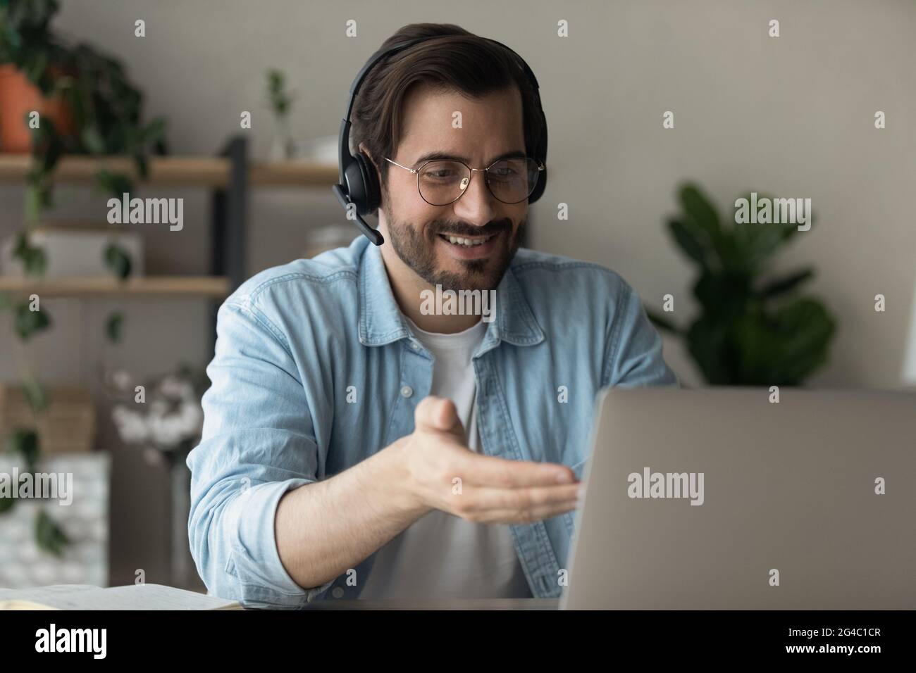 Man headset laptop smiling camera hi-res stock photography and images ...