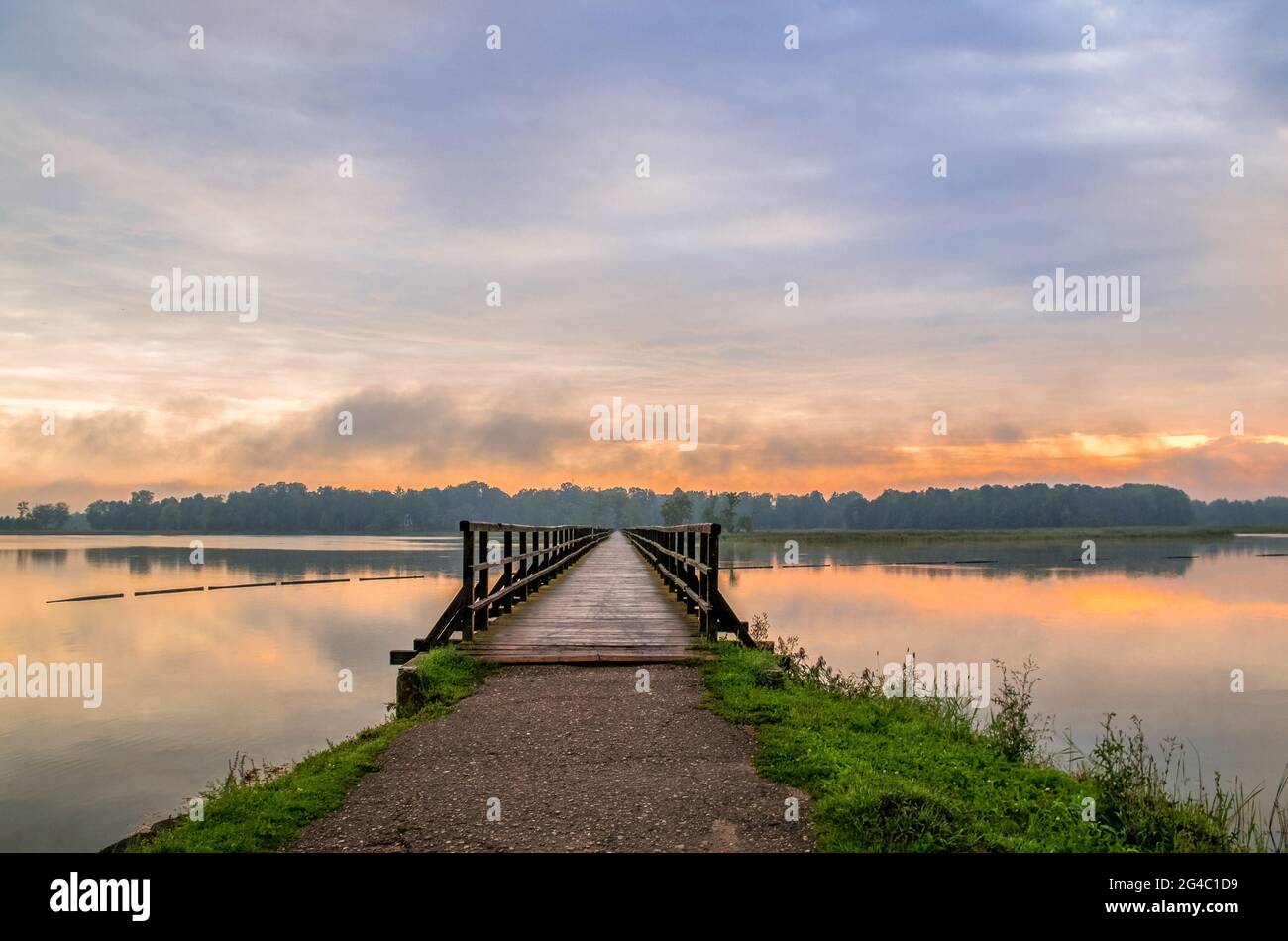 A relaxing and calm morning with a sunrise by the lake Sirvena in ...