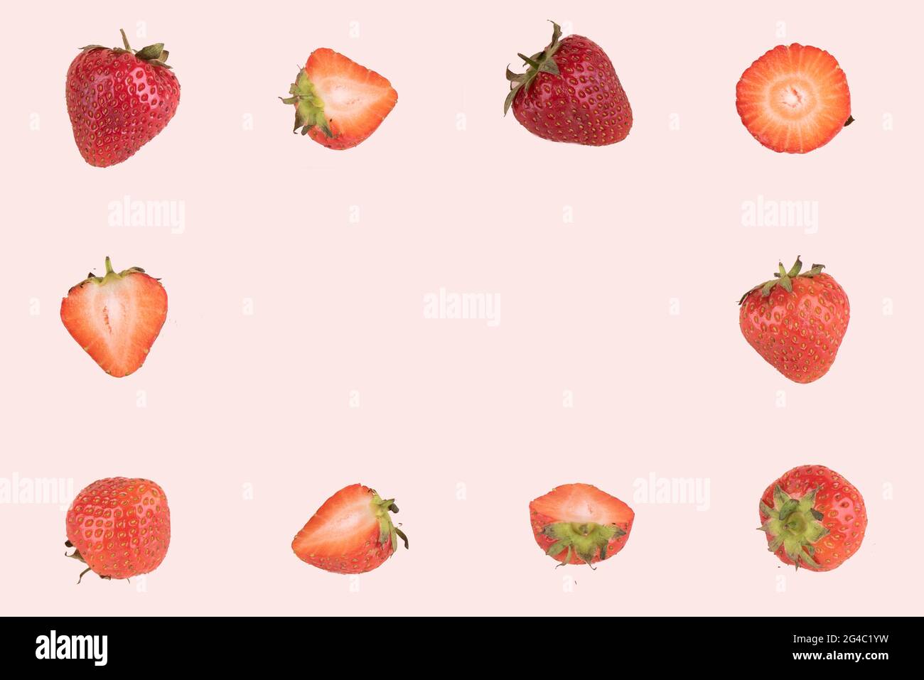 Collage of whole and chopped strawberries on a pink background with ...