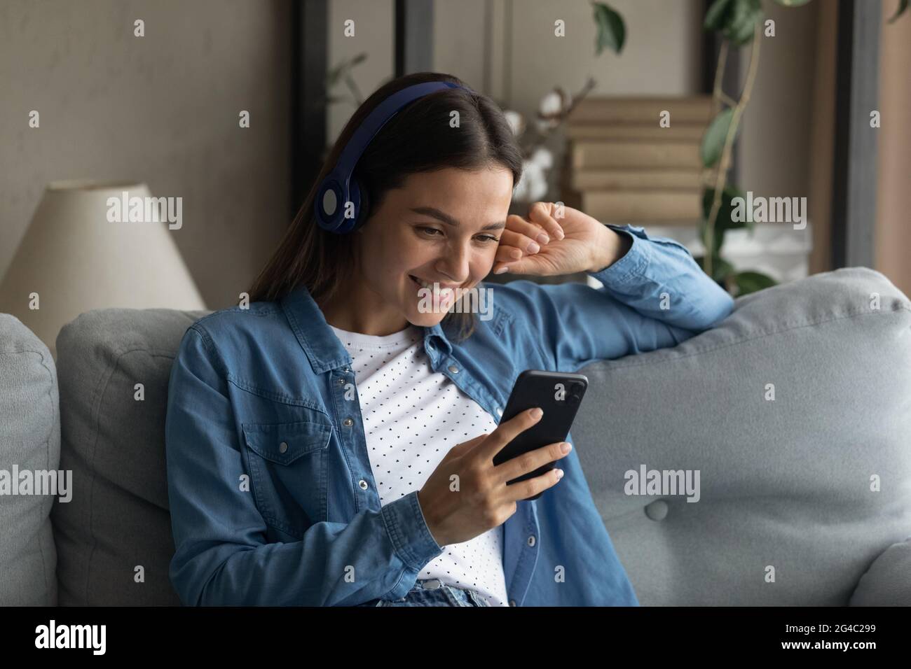 Happy young woman in headphones holding video call conversation Stock ...