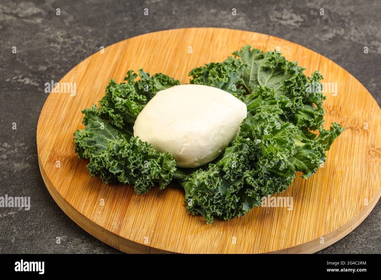 Soft Italian mozzarella cheese over board Stock Photo - Alamy