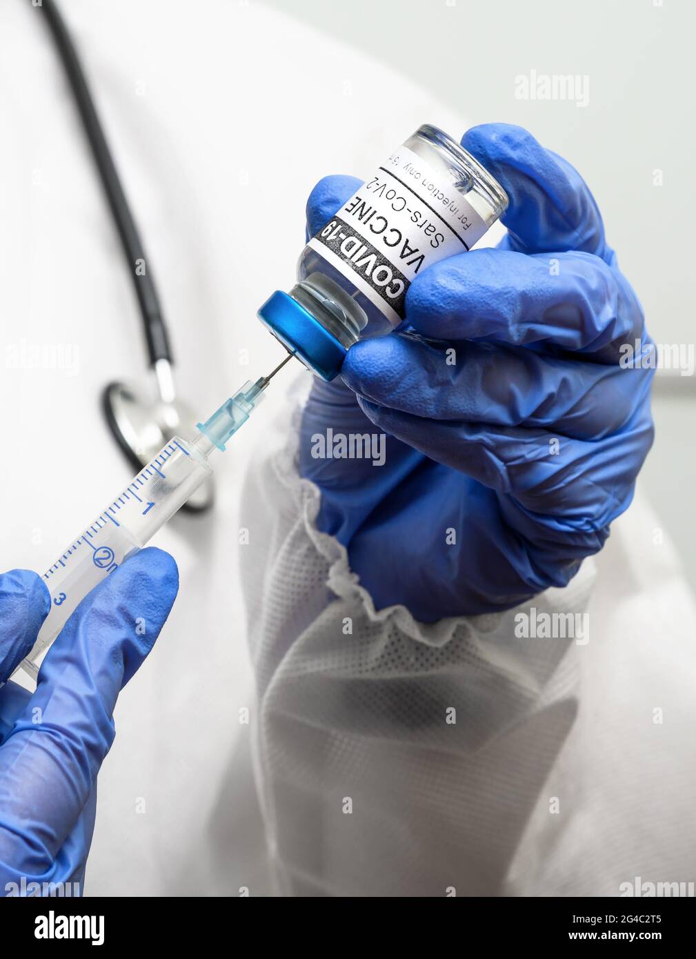 Corona virus vaccine in doctor hands, physician in white holds syringe ...