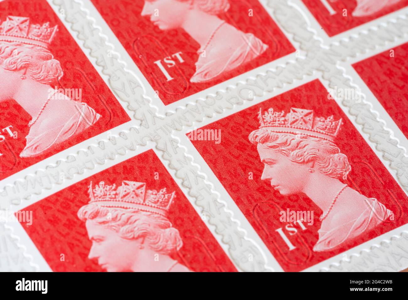 Scarlet red macro closeup images of Royal Mail first class stamps for ...