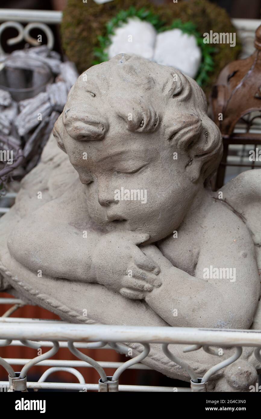 Small decorative stone angel figurine Stock Photo - Alamy