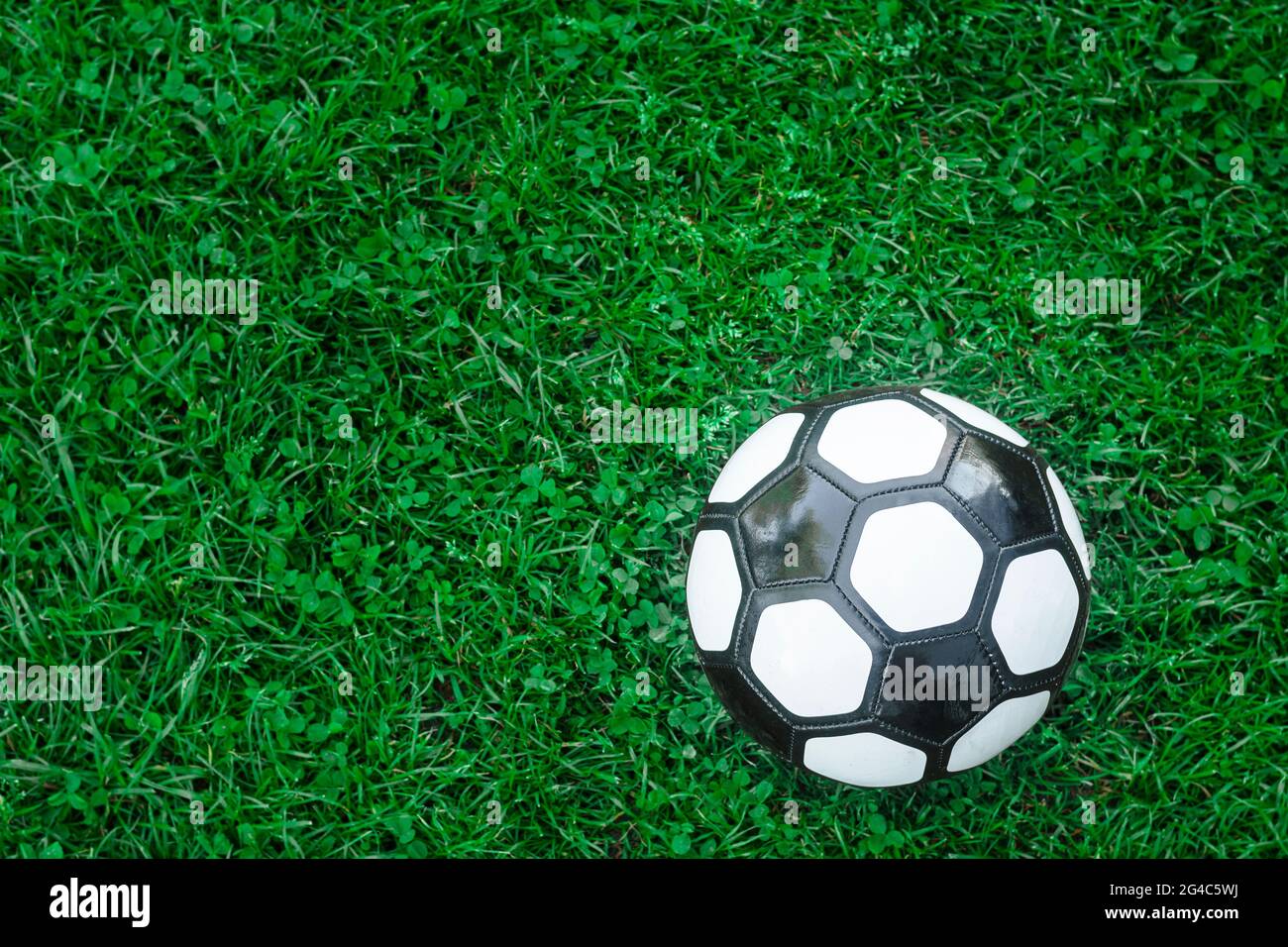 Soccer ball on the field. View from above. Soccer ball lying on green ...