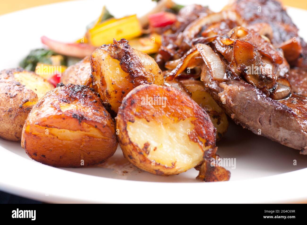 A closeup shot of a delicious meal cooked with potatoes and meat Stock ...
